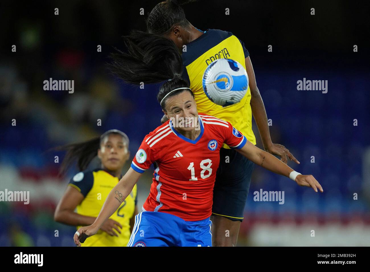 Chile's Camila Saenz, 18, and Ecuador's Ericka Gracia go for a header ...
