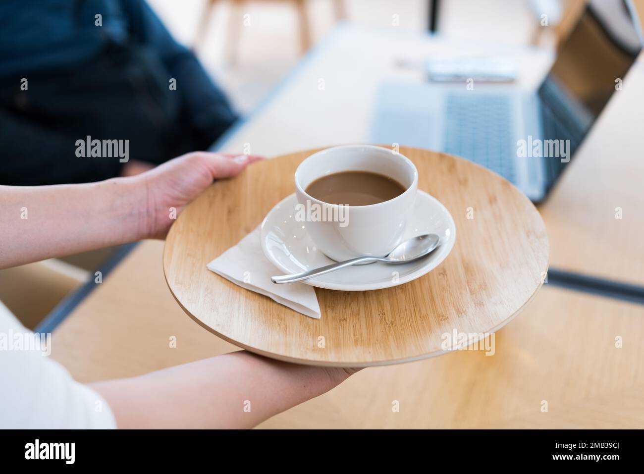 The waiter brought the customer coffee Stock Photo - Alamy