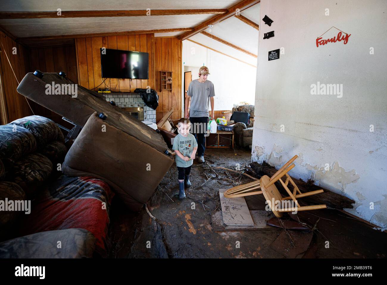 Gage Stanley, 3, walks through his destroyed house, Thursday, July 14 ...