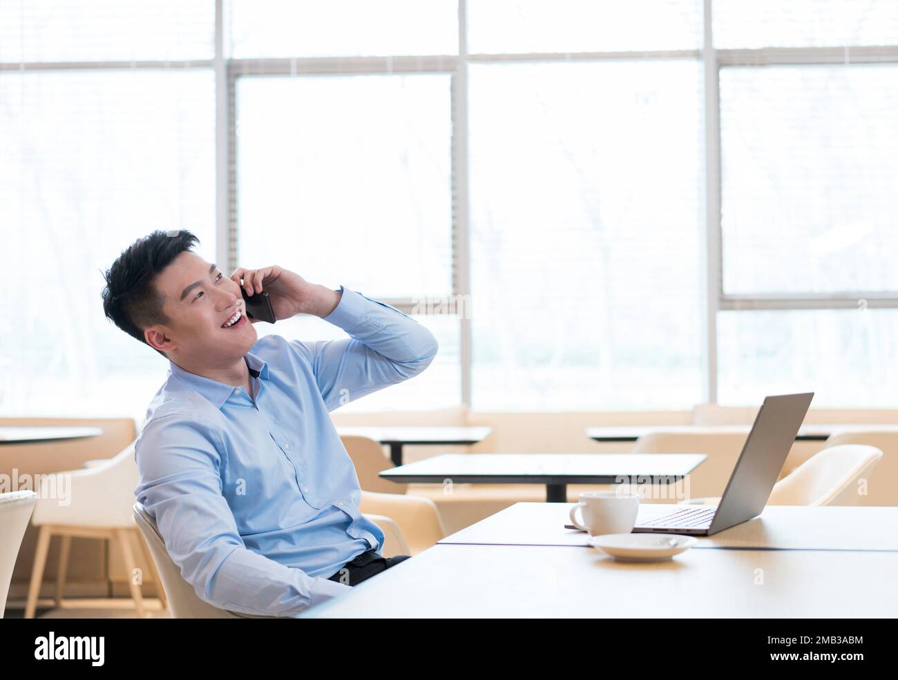 Business men in the Internet cafe Stock Photo - Alamy
