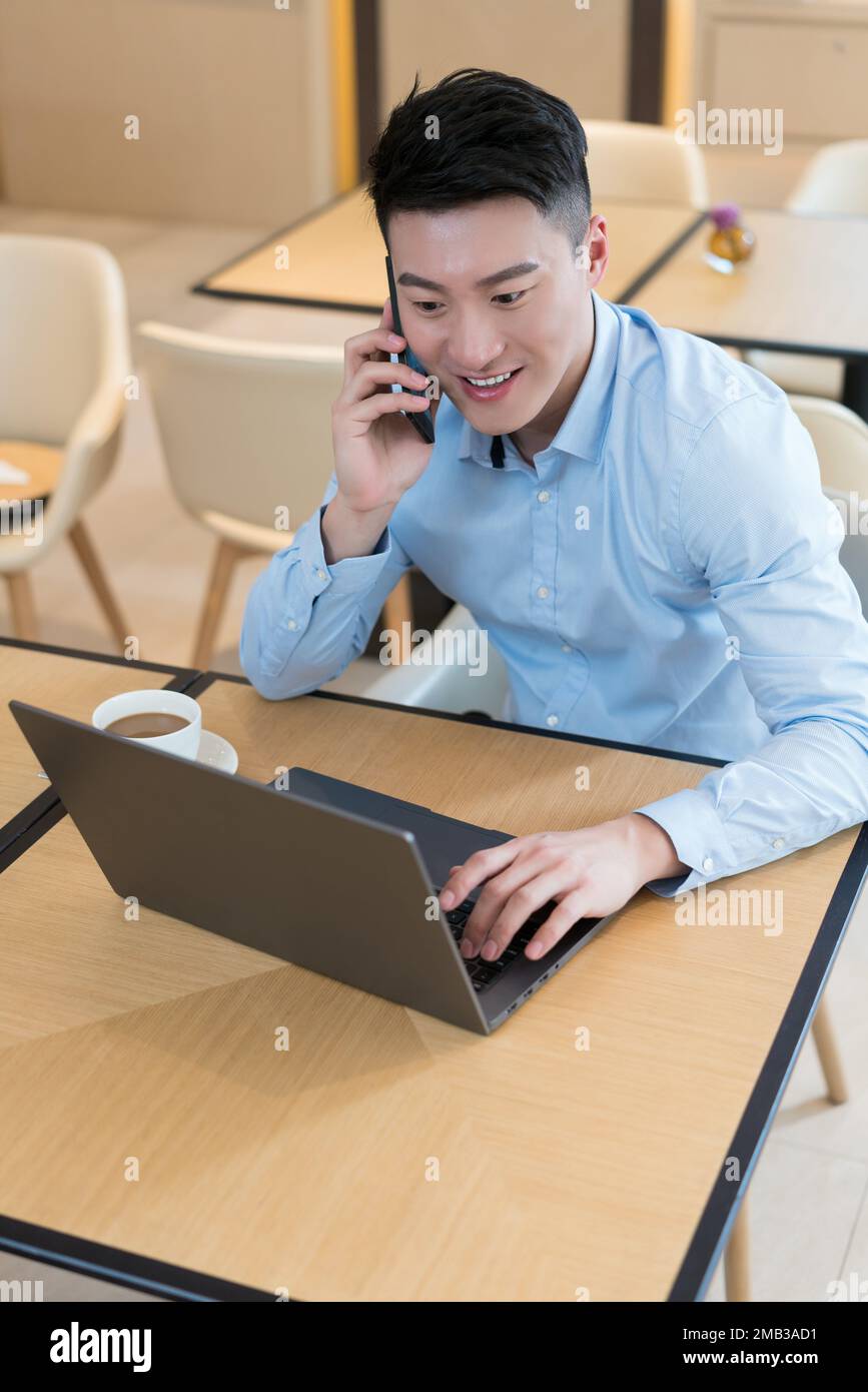Business men in the Internet cafe Stock Photo - Alamy