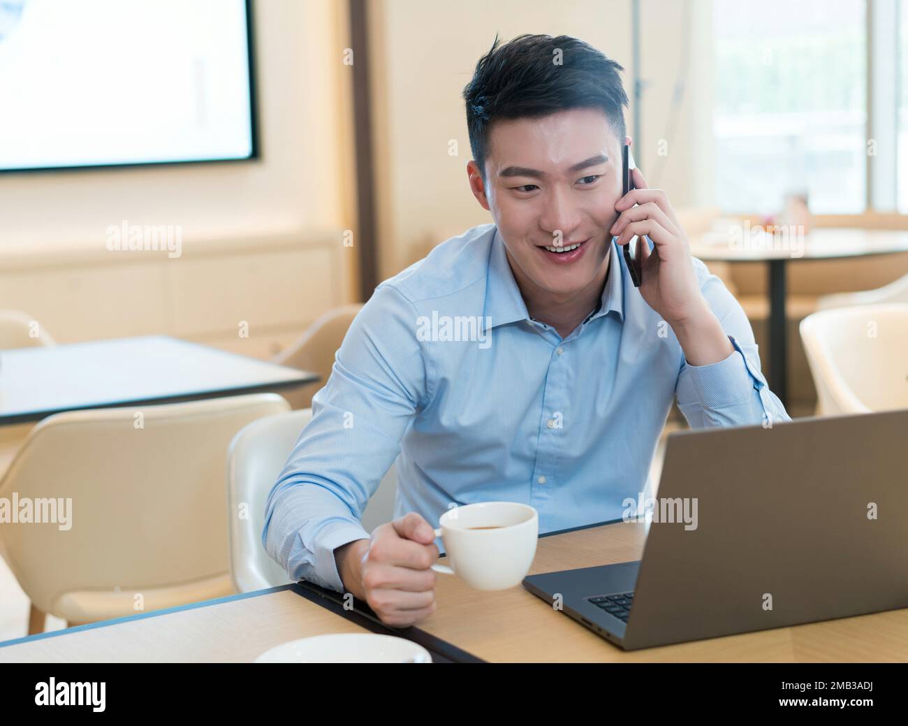 Business men in the Internet cafe Stock Photo - Alamy