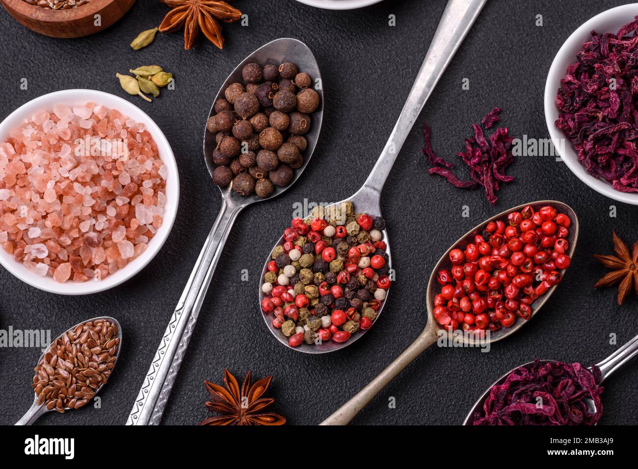 Composition consisting of variations of spices in white bowls and metal ...