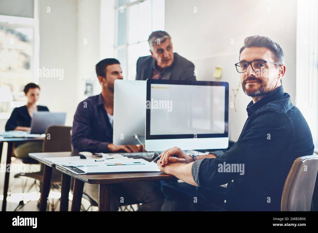 Portrait, mature and business man by computer in office workplace ...