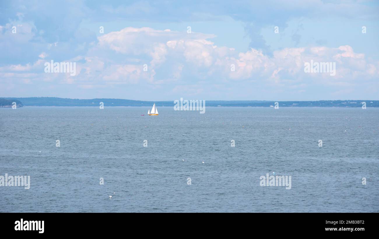 A boat sailing in sea under blue sky Stock Photo - Alamy