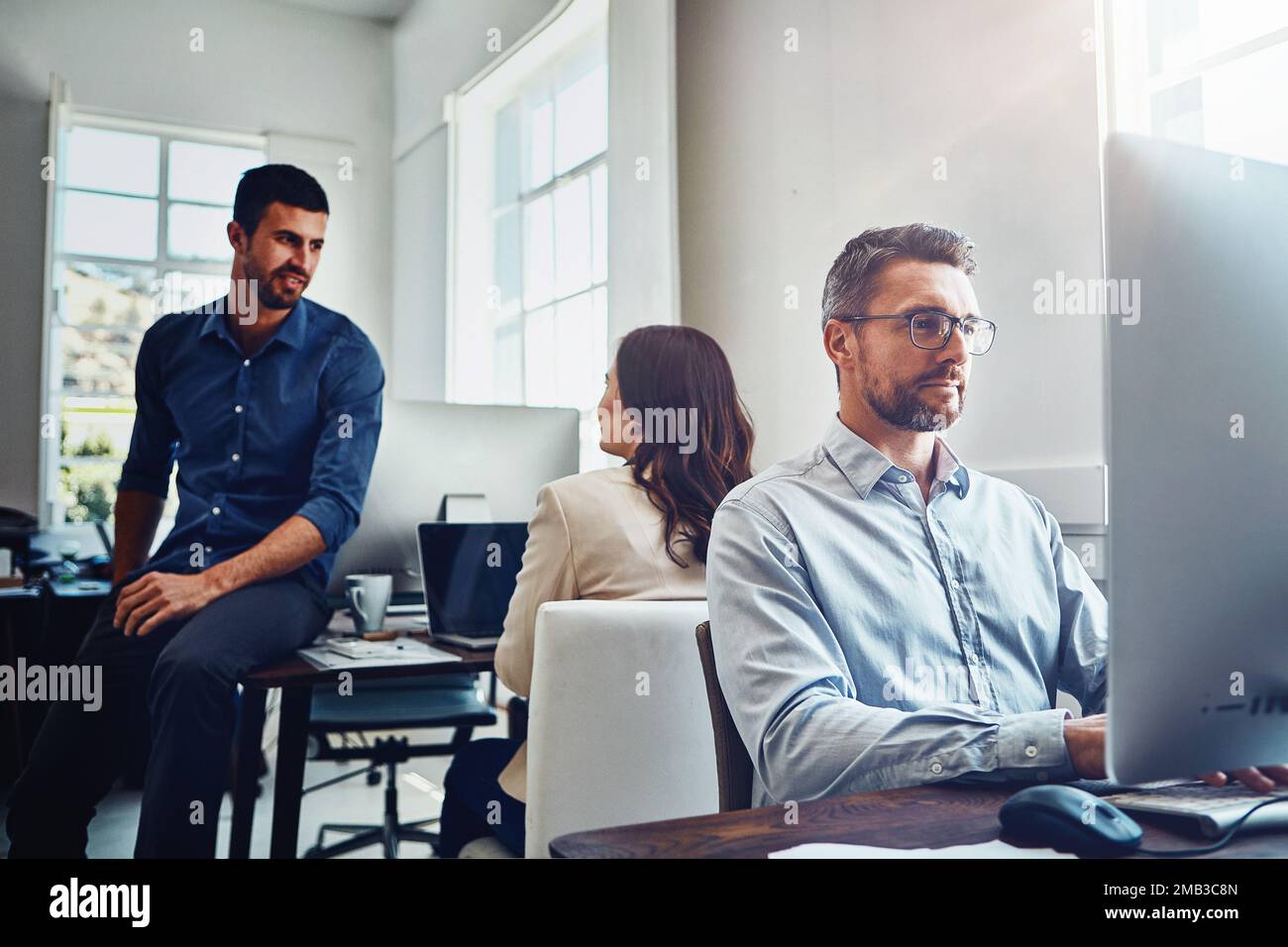 Teamwork, office and business people at desk working on planning ...