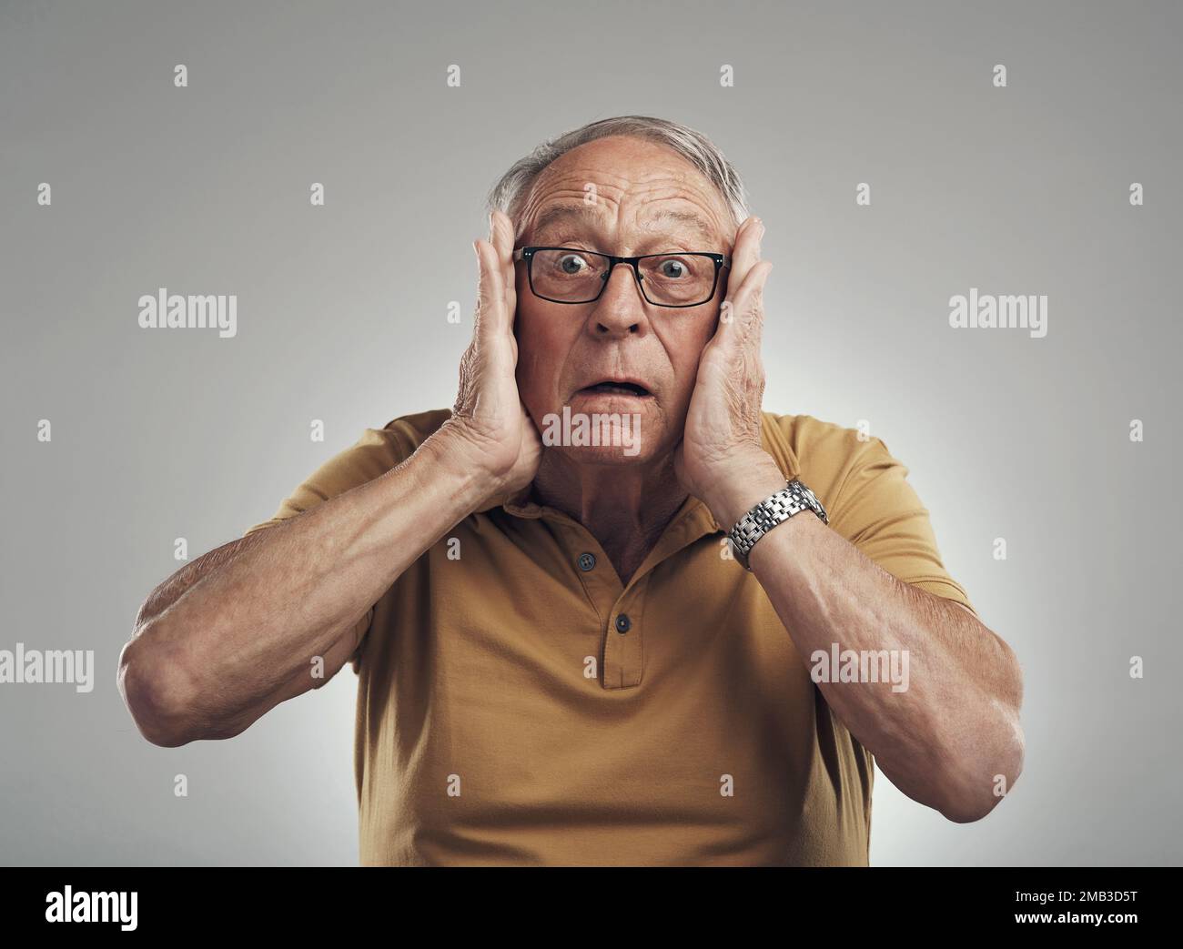 How I look when watching a horror movie. Studio shot of an elderly man ...