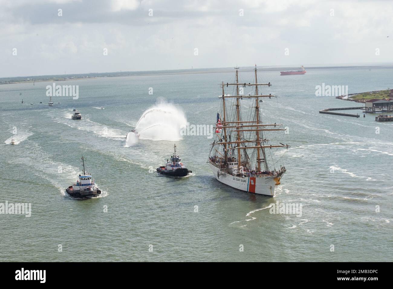 U.S. Coast Guard Cutter Barque Eagle leads a regatta through the ...