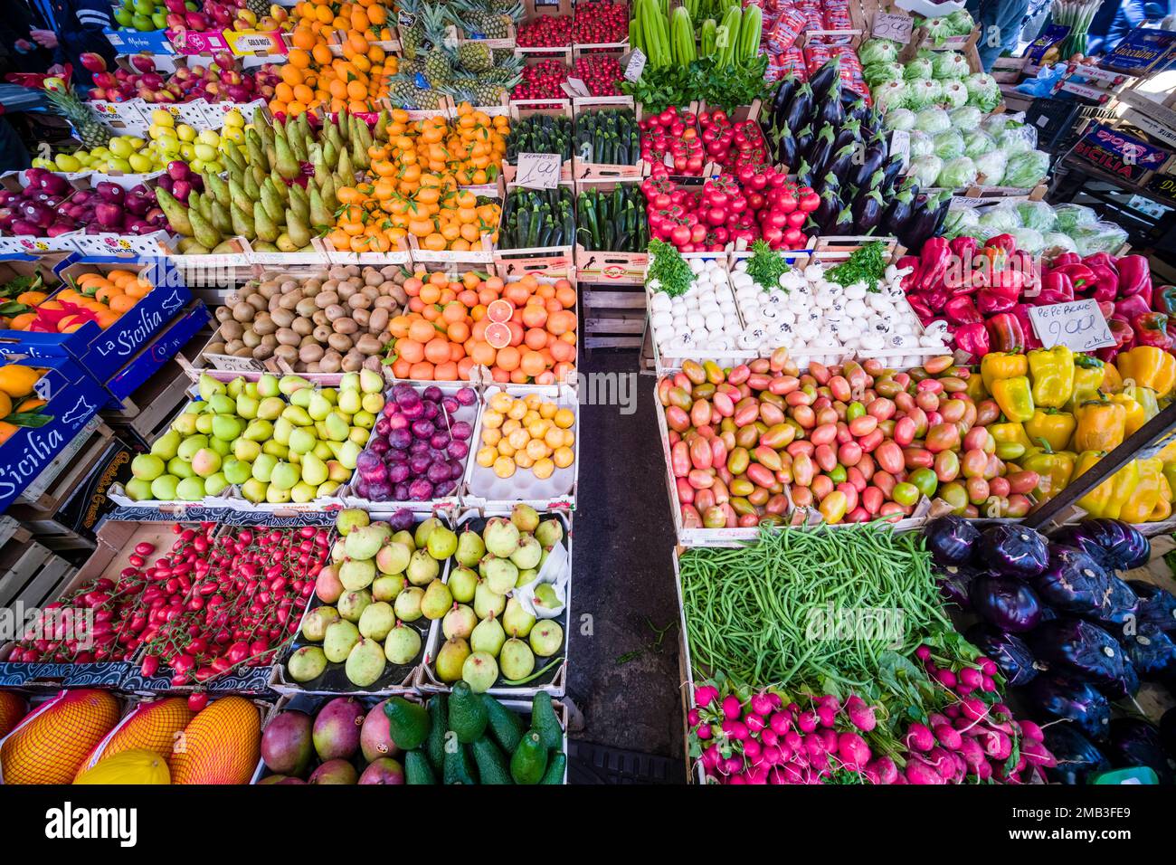 All kinds of fruits and vegetables are displayed for sale in the local ...