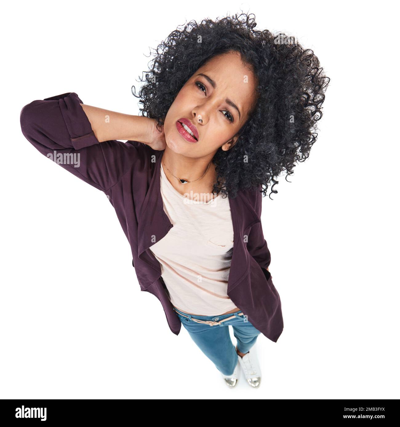 Tired, neck pain and black woman in studio portrait with moody, unhappy ...