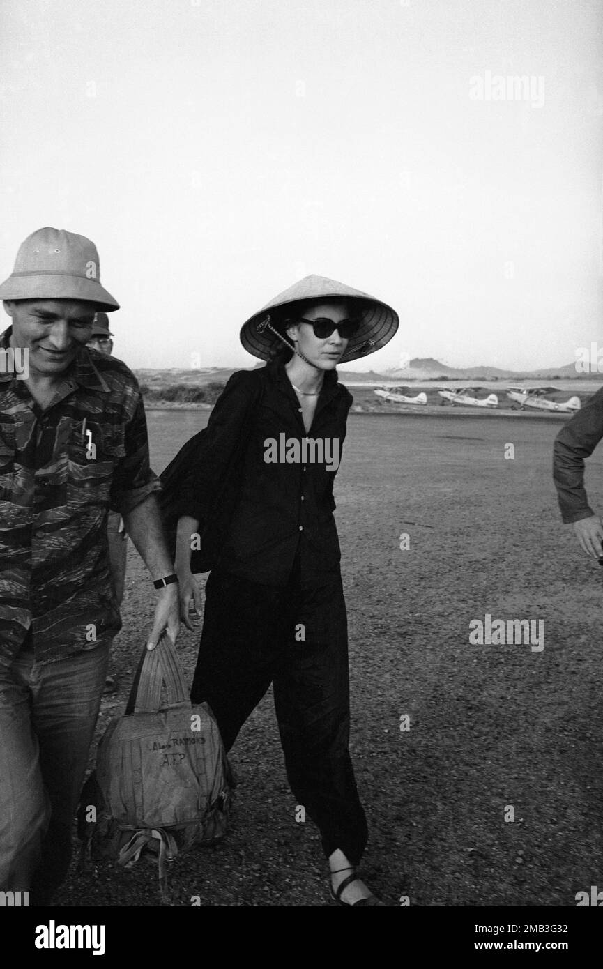 French freelance journalist Michele Ray walks to a plane in An Khe ...