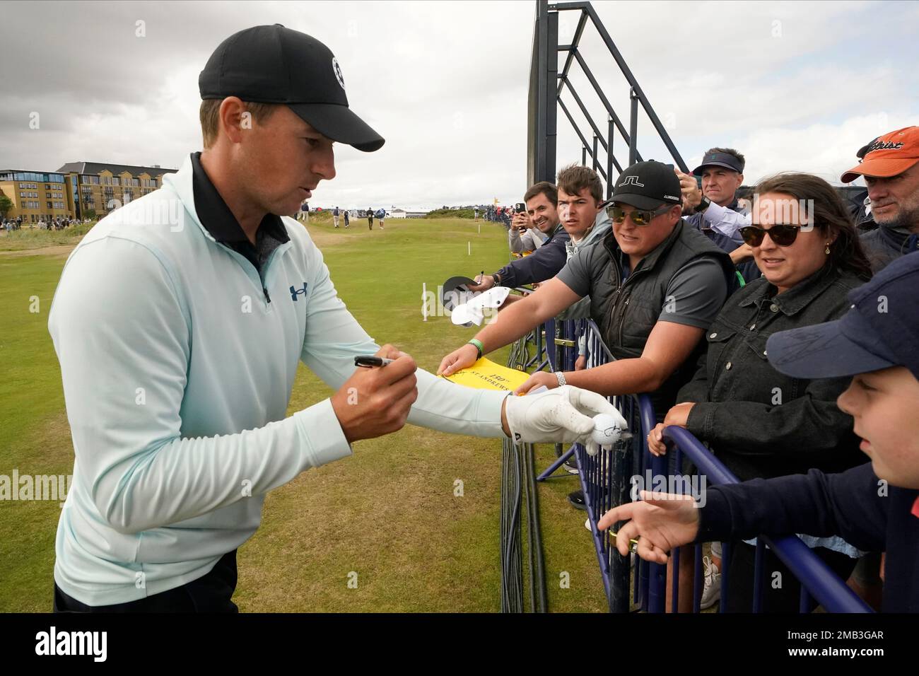 Jordan Spieth of the US signs autographs during a practice round at the ...