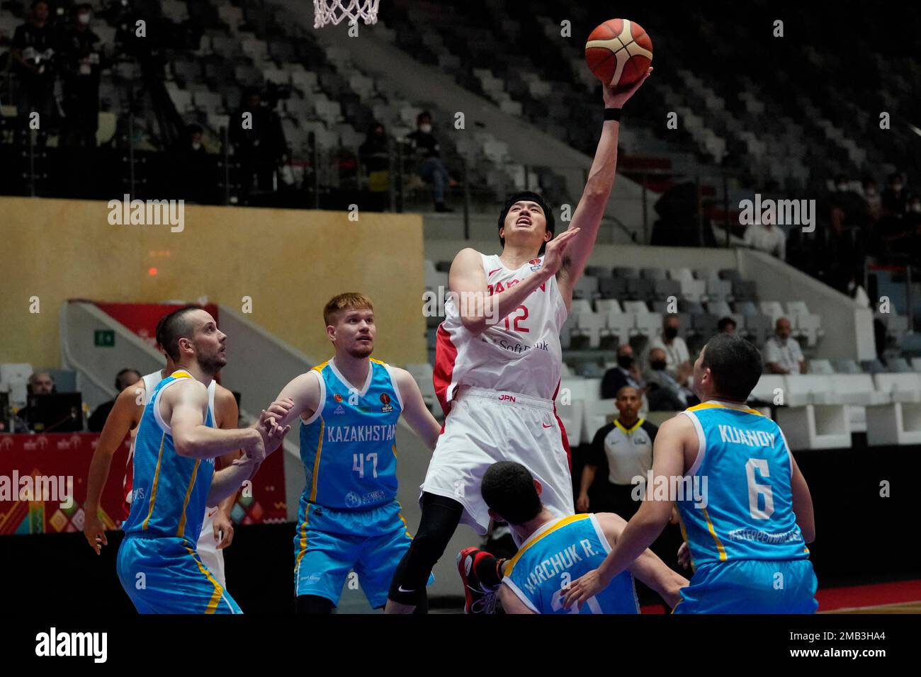 Japan's Yuta Watanabe, center, shoots against Kazakhstan's Ruslan ...