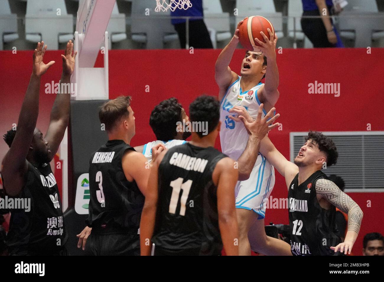 India's Prashant Singh Rawat, top right, goes up against New Zealand's ...