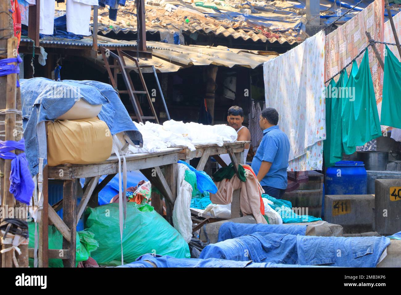 December 21 2022 - Mumbai, Maharashtra in India: People washing clothes ...