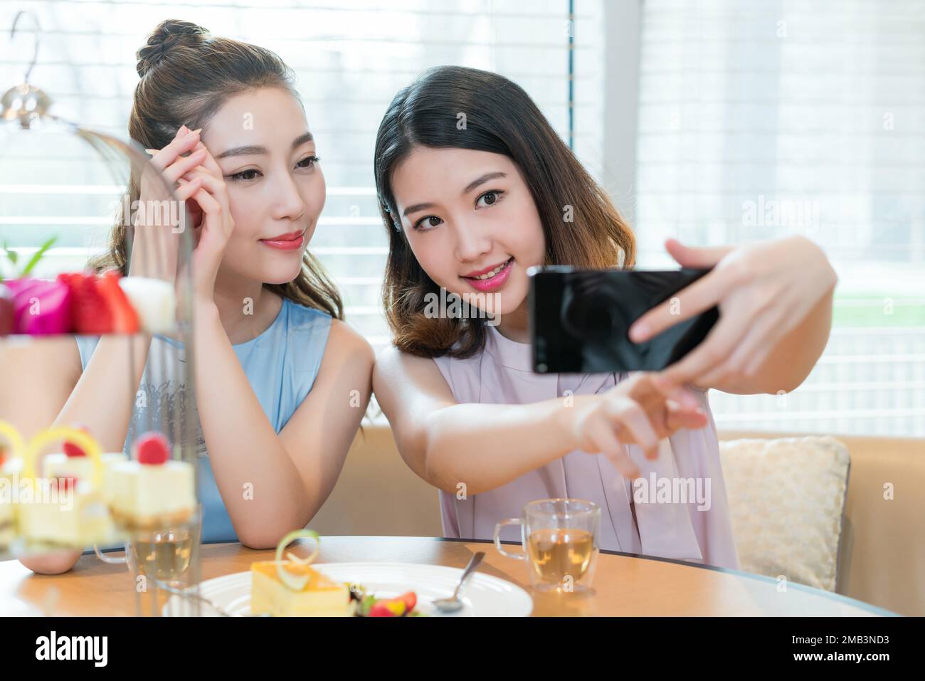 Young woman's afternoon tea time Stock Photo - Alamy