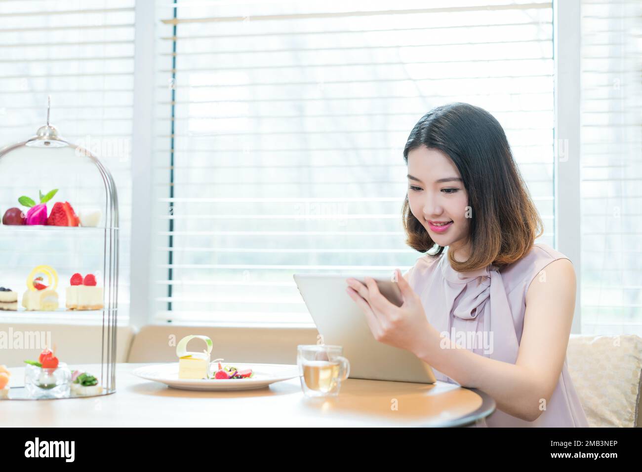 Young woman's afternoon tea time Stock Photo - Alamy