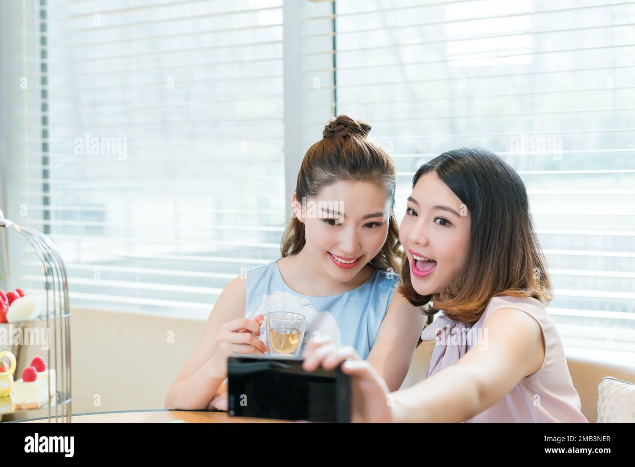 Young woman's afternoon tea time Stock Photo - Alamy