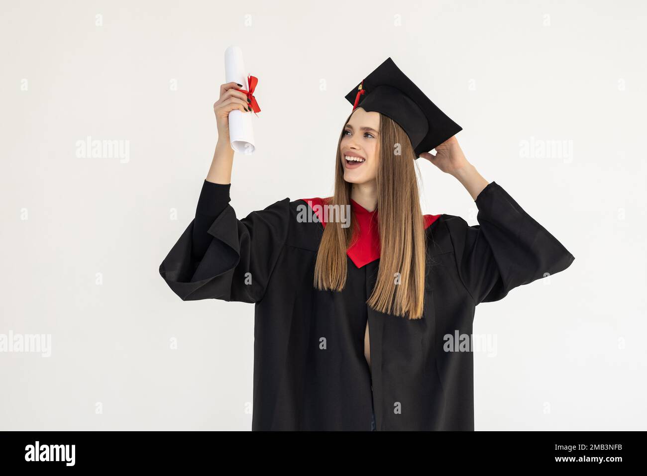 Young graduate girl student in mantle with diploma, isolated on white ...