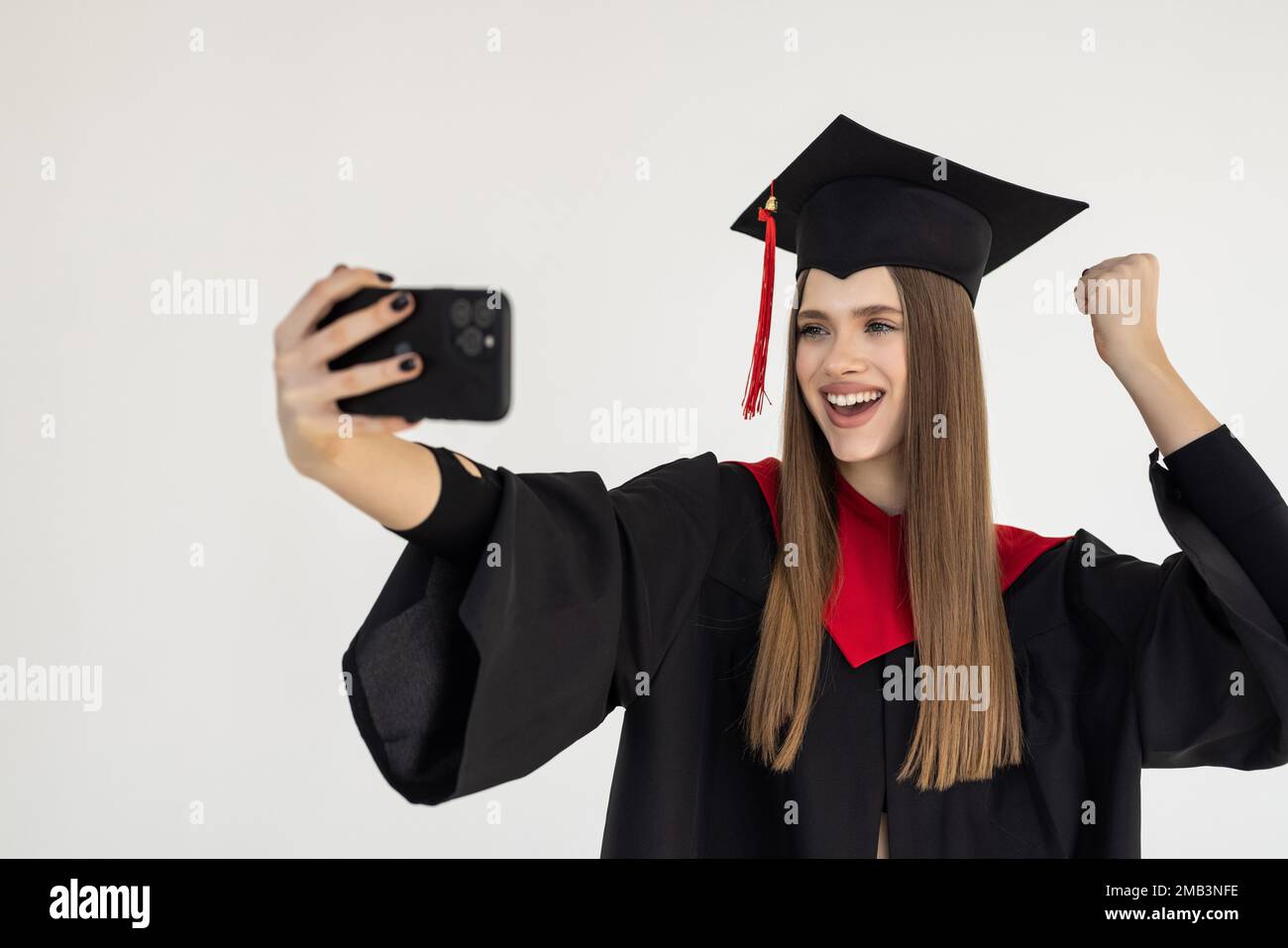 Female graduate taking selfie with diploma on white background Stock ...