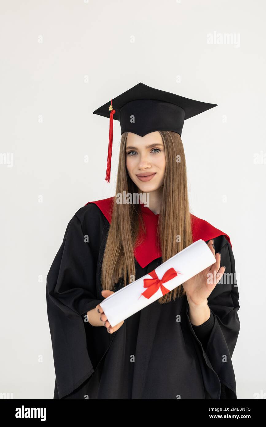 Young graduate girl student in mantle with diploma, isolated on white ...