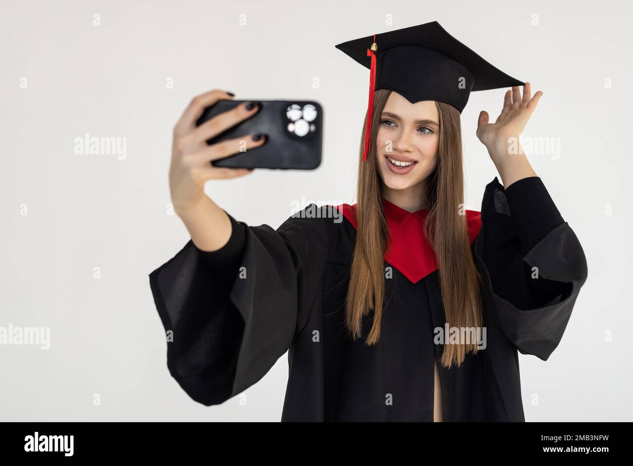 Female graduate taking selfie with diploma on white background Stock ...