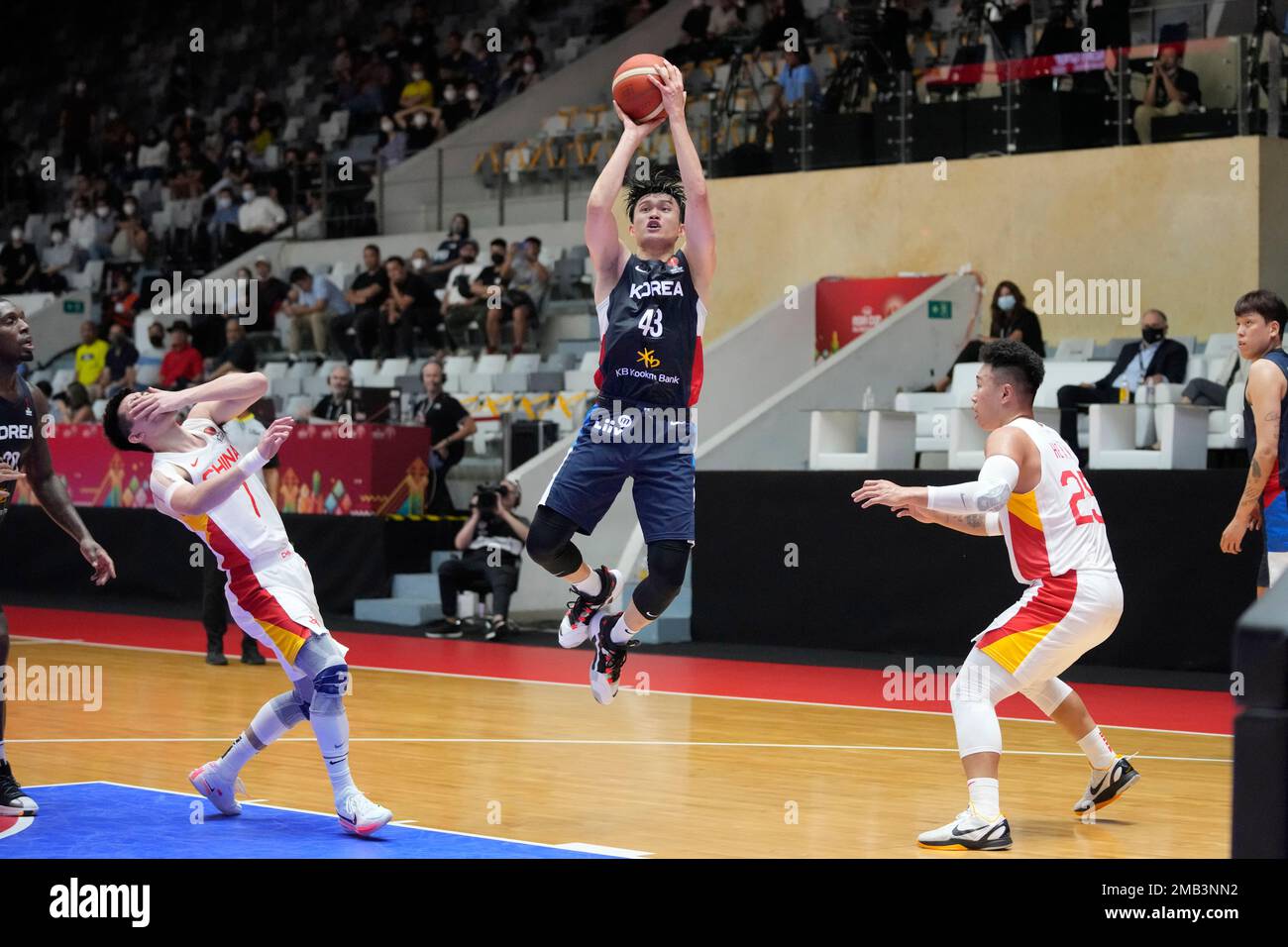South Korea's Lee Dae-sung, center, shoots against China's Sun Minghui ...