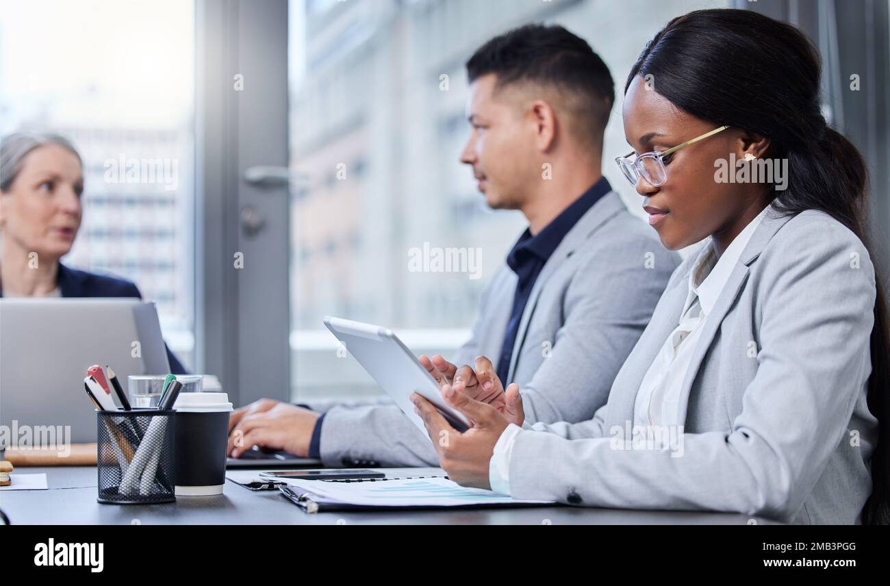 Taking notes while listening to everyones contribution. a young ...