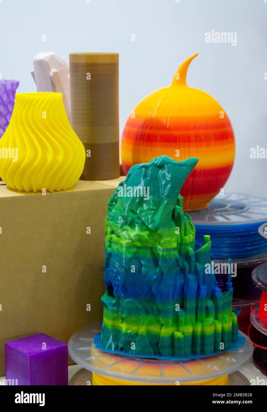 Several different abstract multi-color models printed on a 3D printer ...