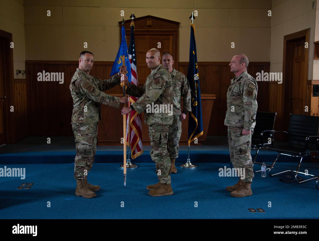 Capt. Noah Irshad accepts the 142nd Security Forces Squadron guidon ...