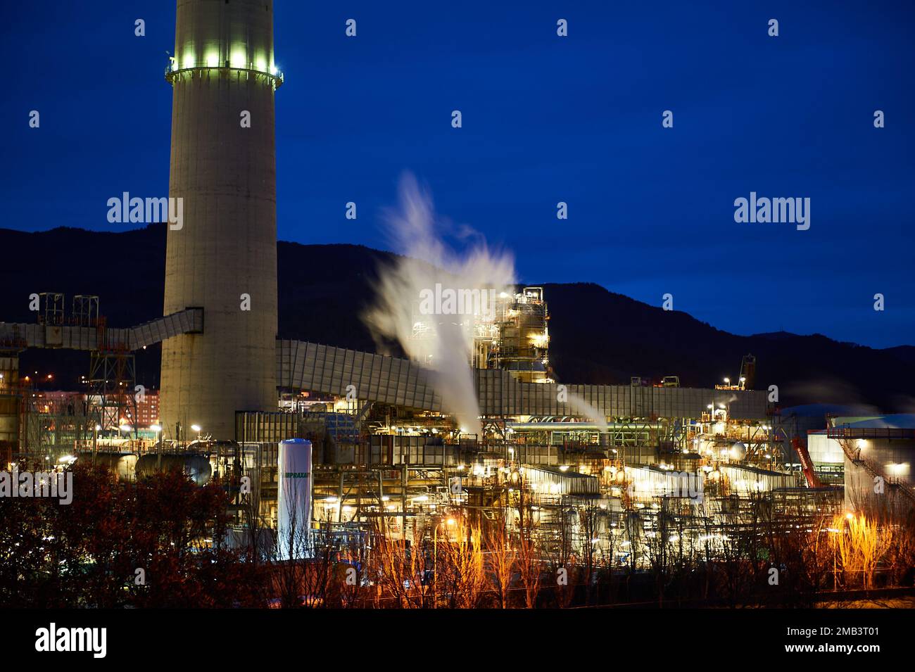 Main tower and chimneys of the refinery in the municipality Bizkaino of ...