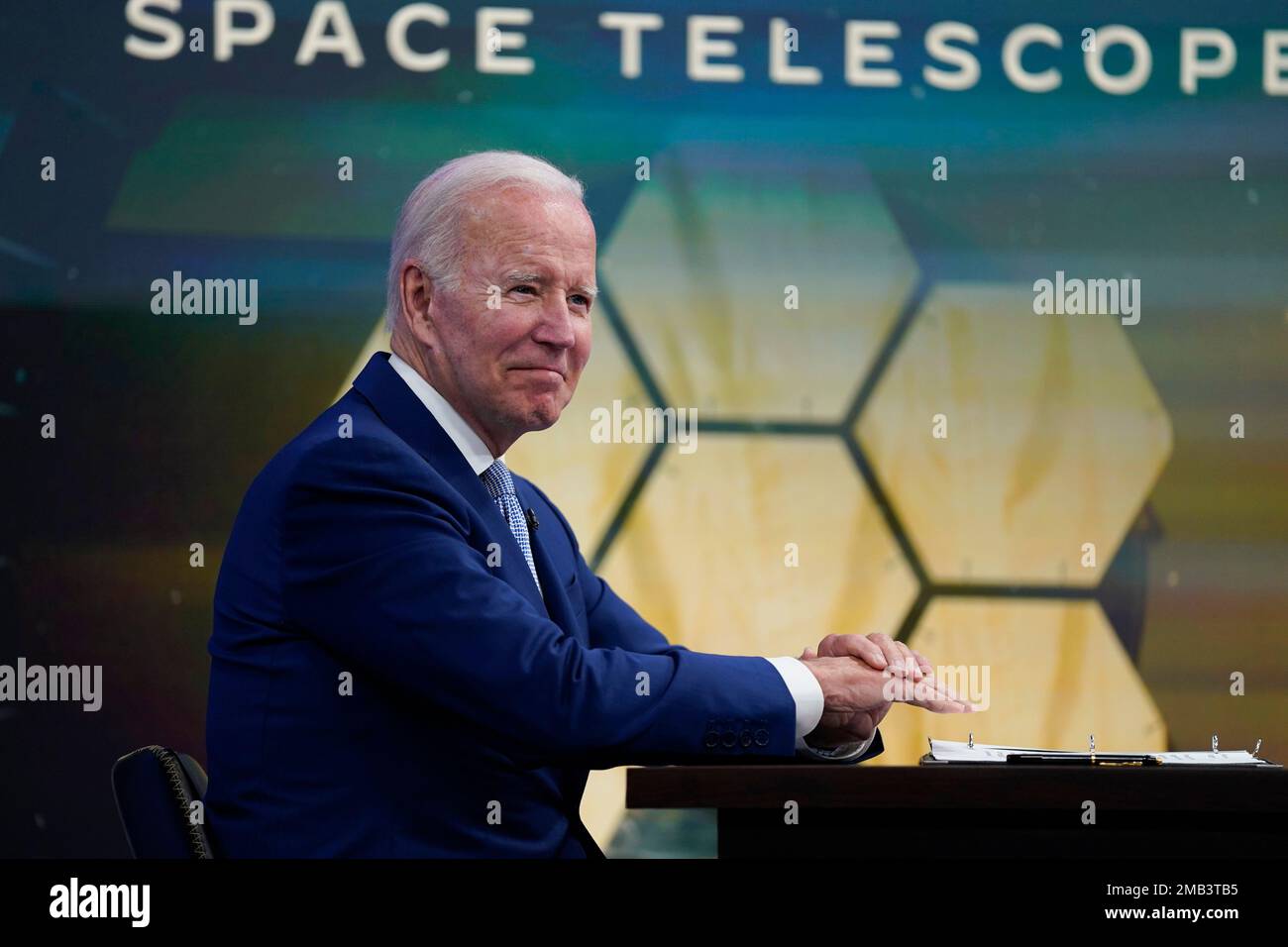 President Joe Biden listens during a briefing from NASA officials about ...
