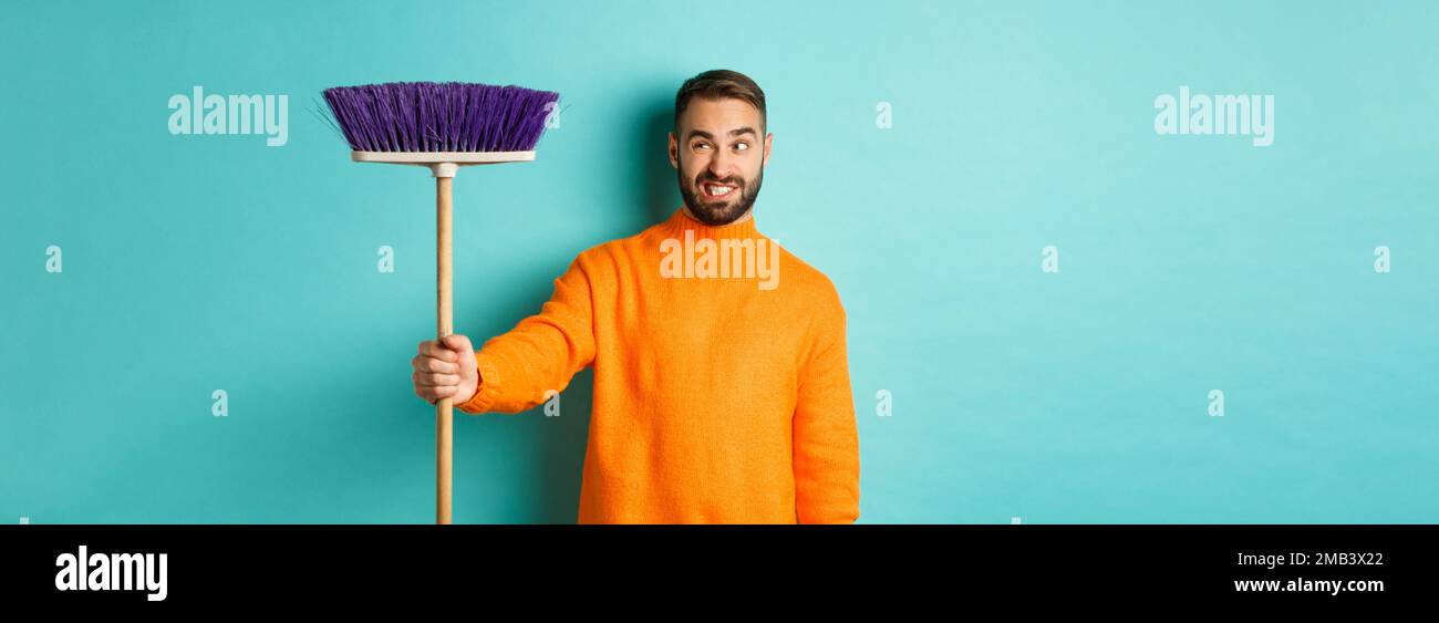 Boyfriend looking confused at broom, forced clean house, doing chores ...