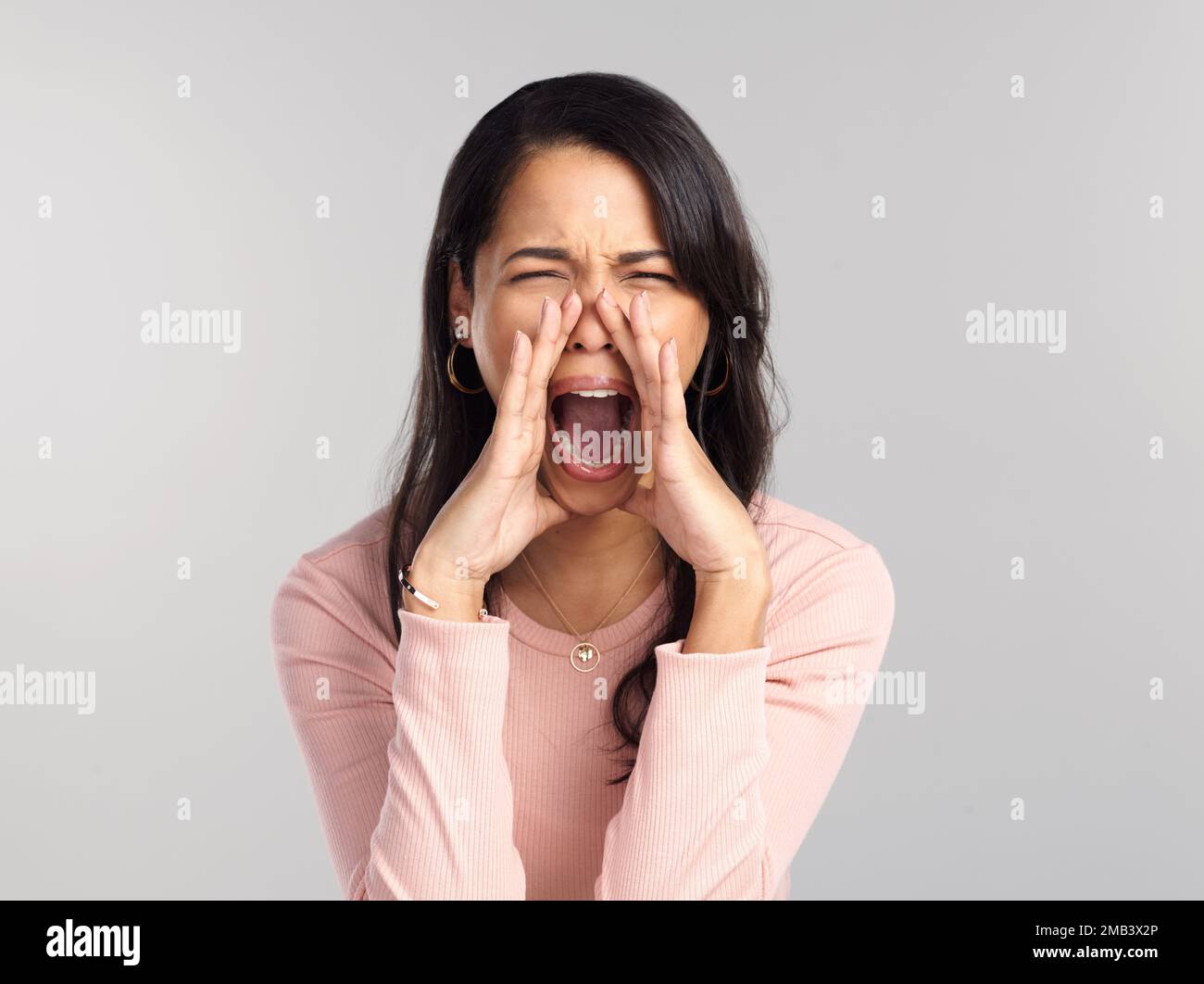 This is a call for help. a beautiful young woman shouting while ...