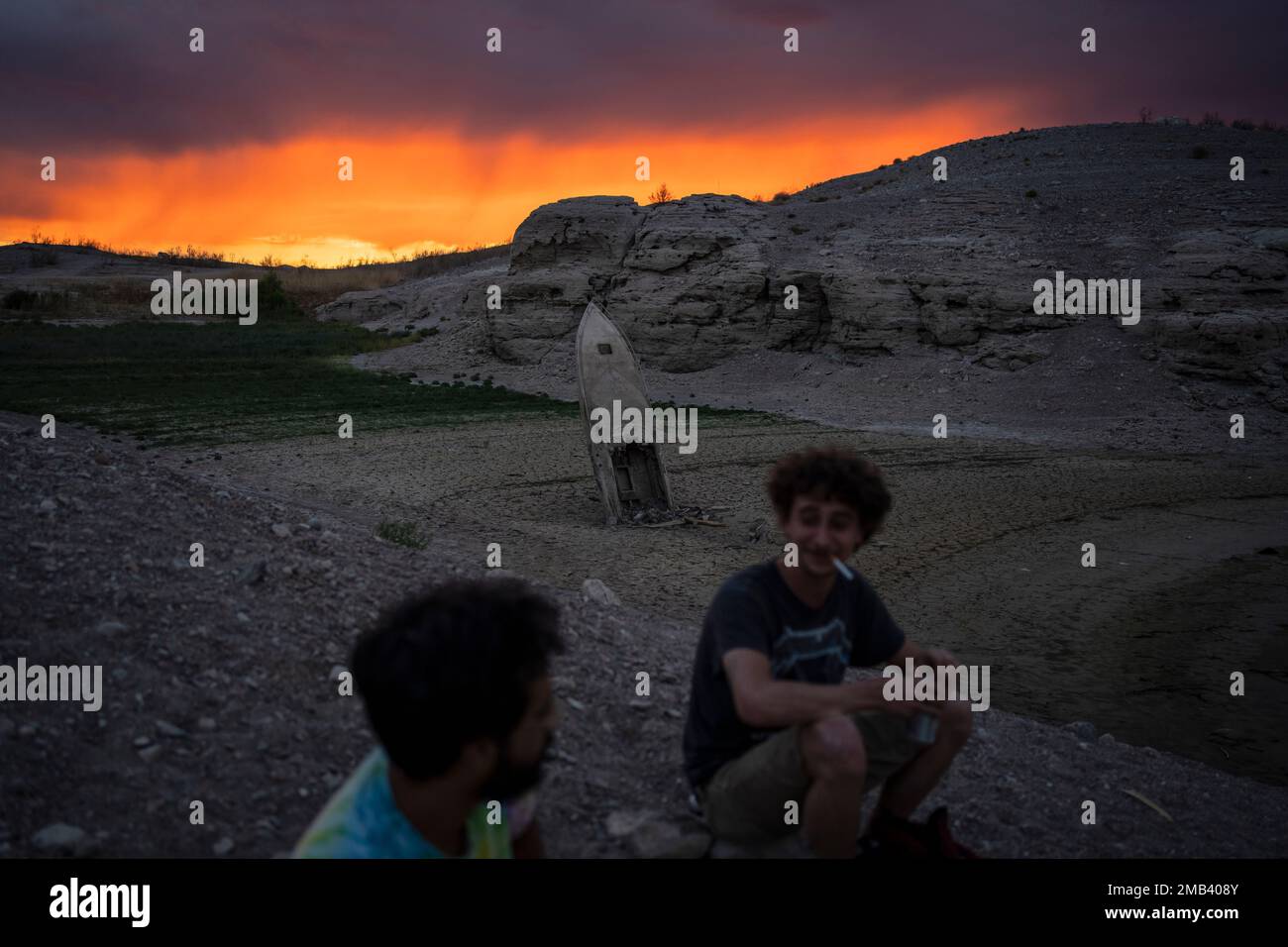 Bobby Rhinebolt, right, smokes a cigarette while sitting beside Victor ...