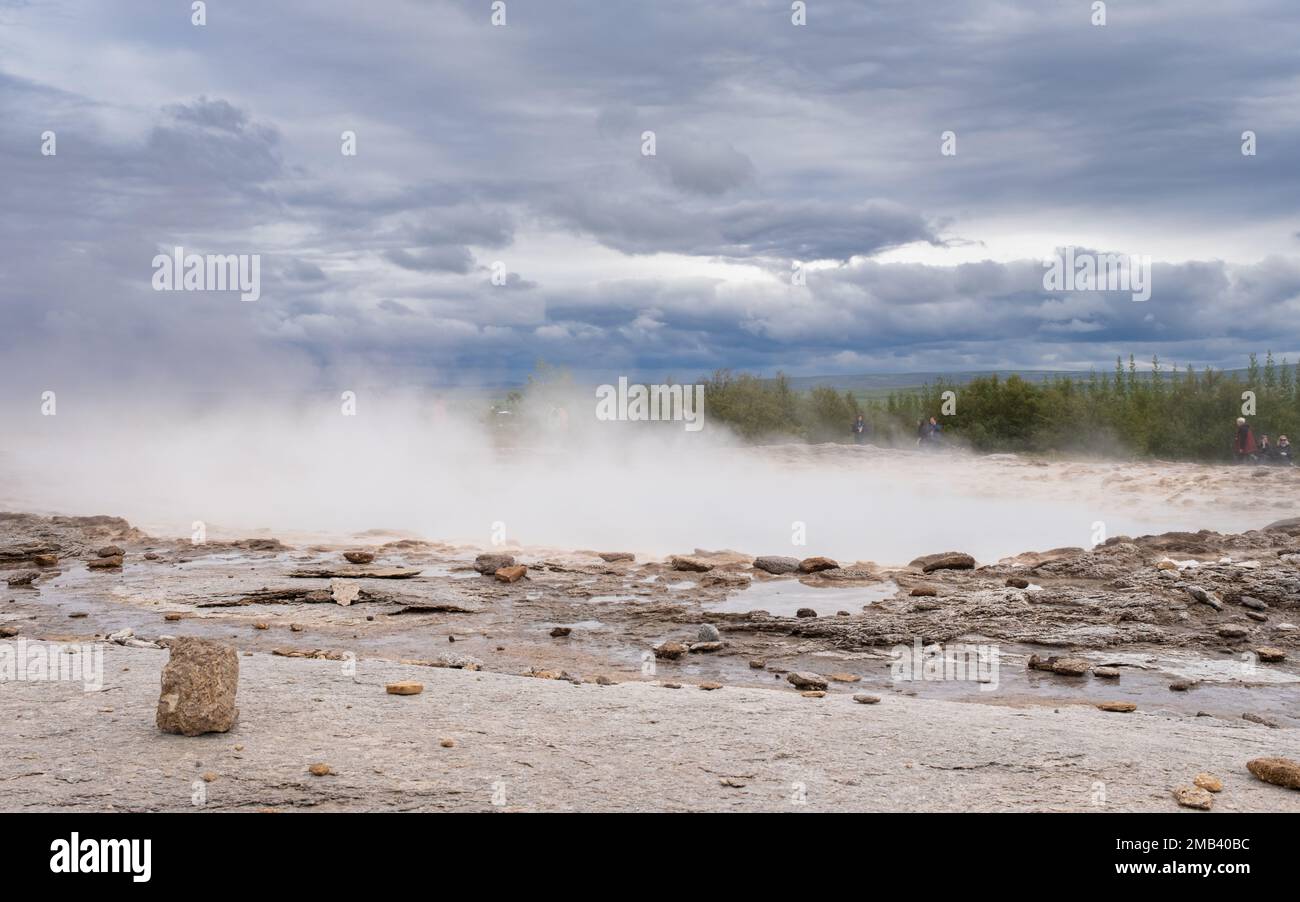 Steam rising from the Great Geysir at Haukadular geothermal area ...