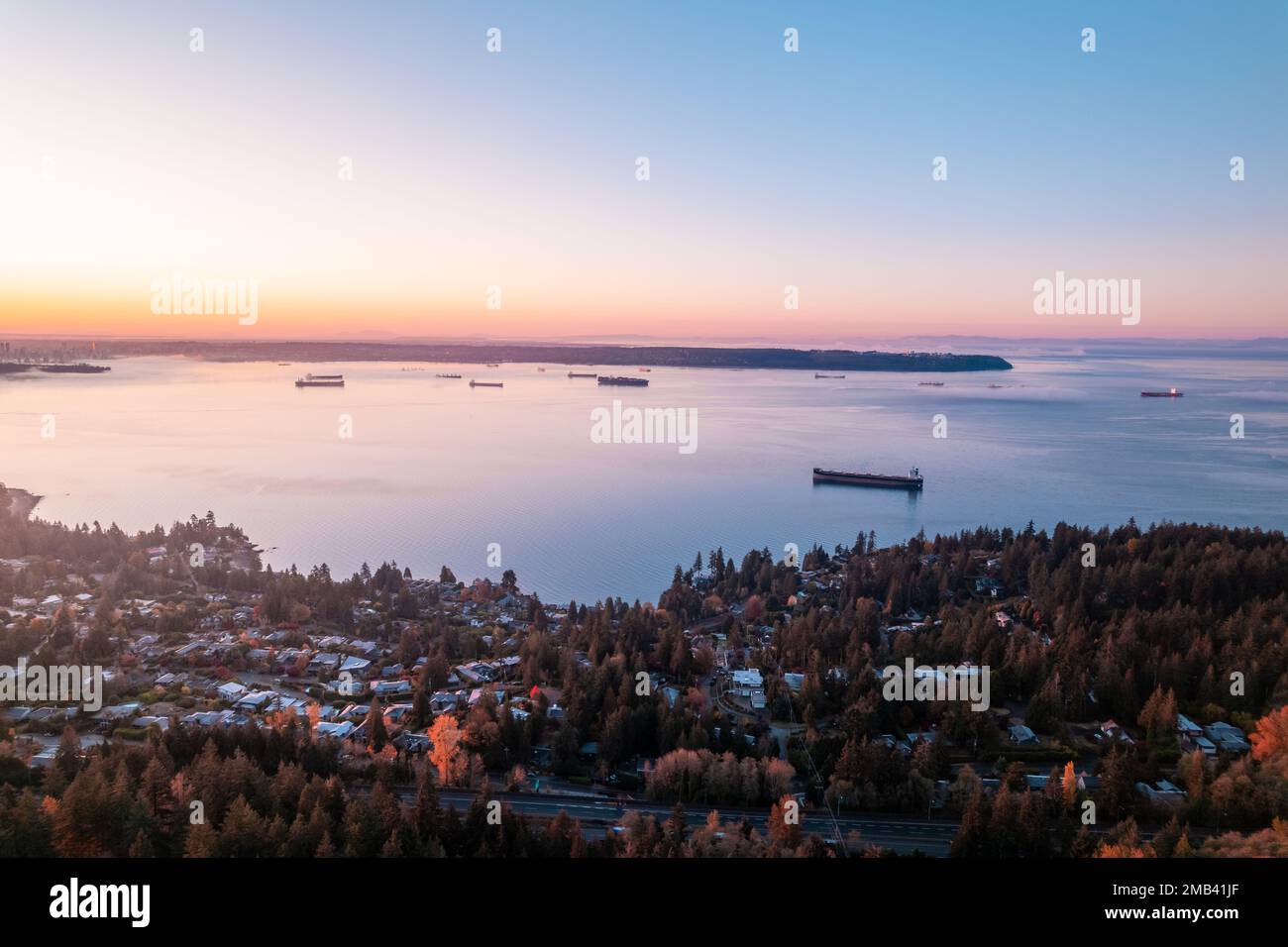 Aerial view of West Vancouver and Vancouver, sunrise ocean cityscape ...
