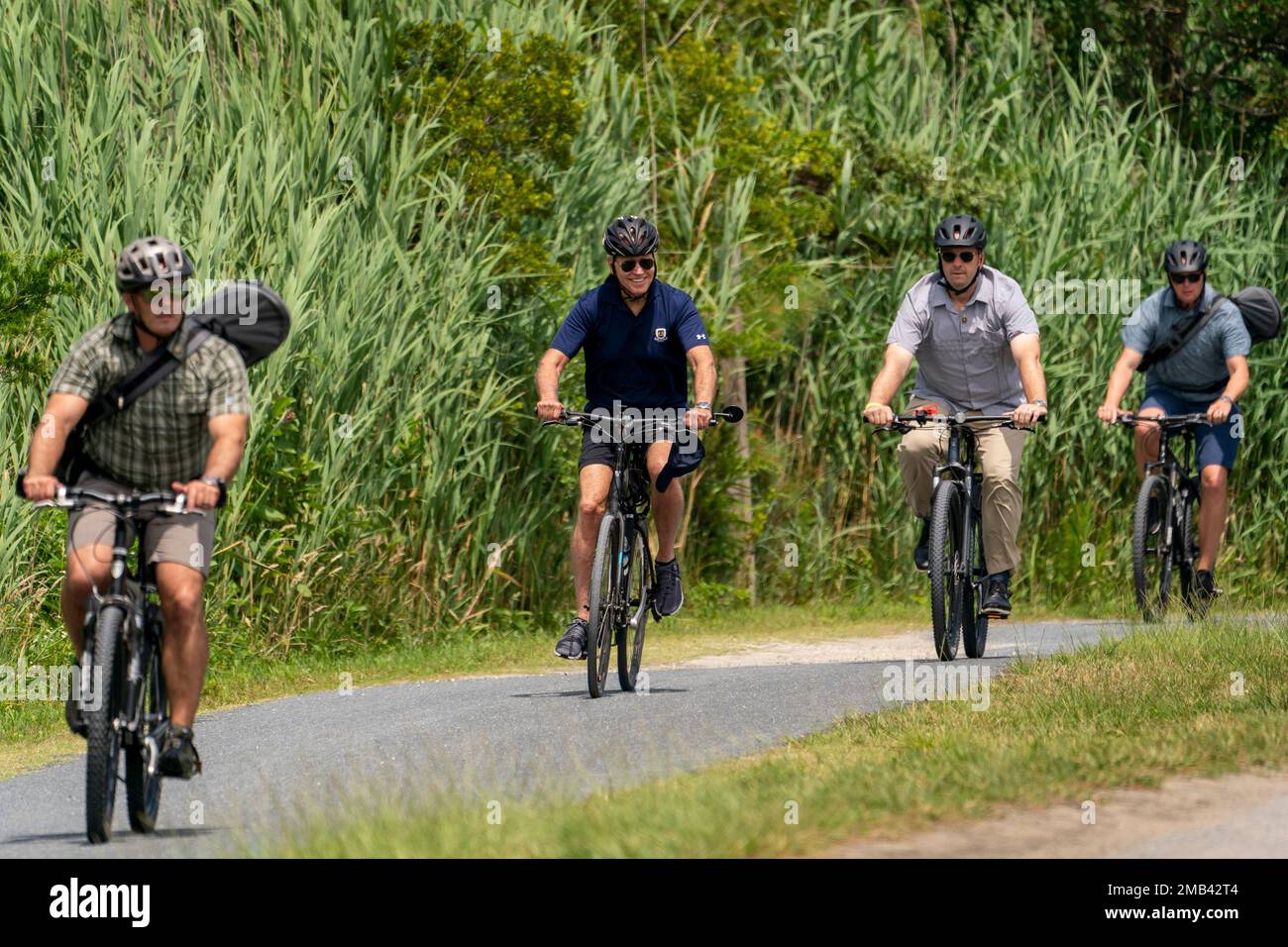 President Joe Biden goes on a bike ride in Gordons Pond State Park in ...