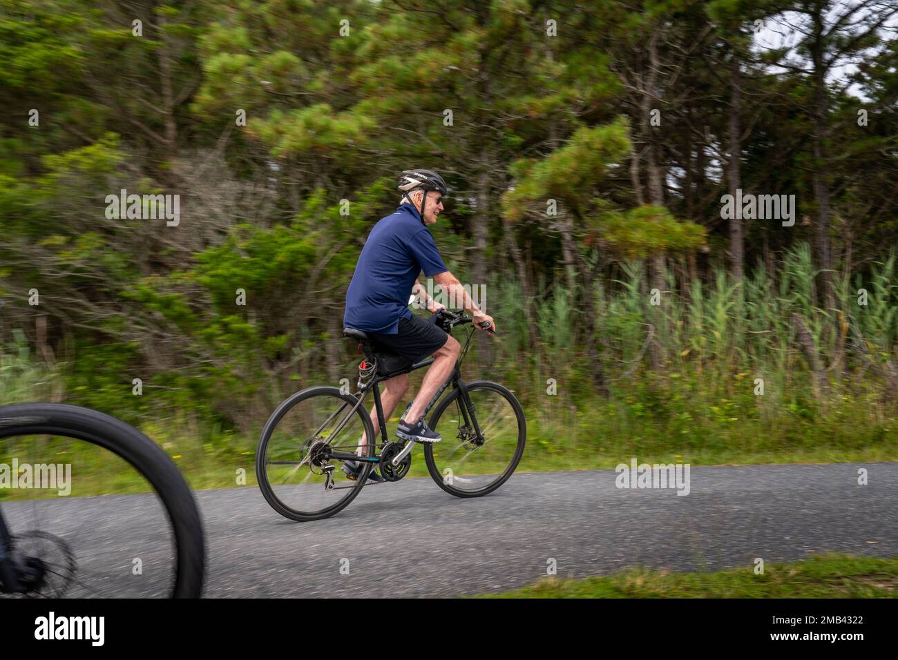 President Joe Biden goes on a bike ride in Gordons Pond State Park in ...