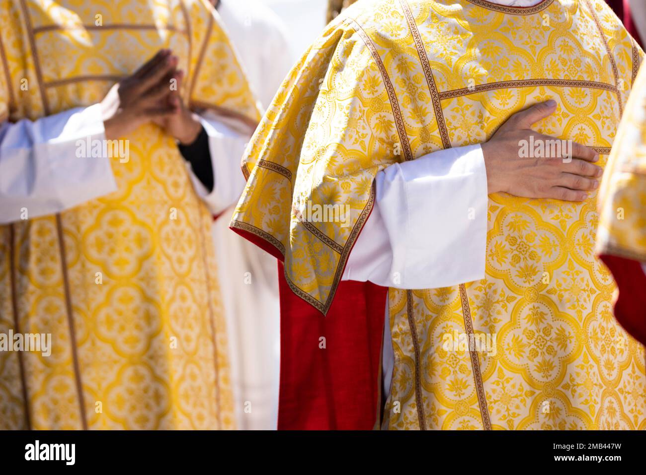 Praying altar boys with folded hands during the Corpus Christi ...