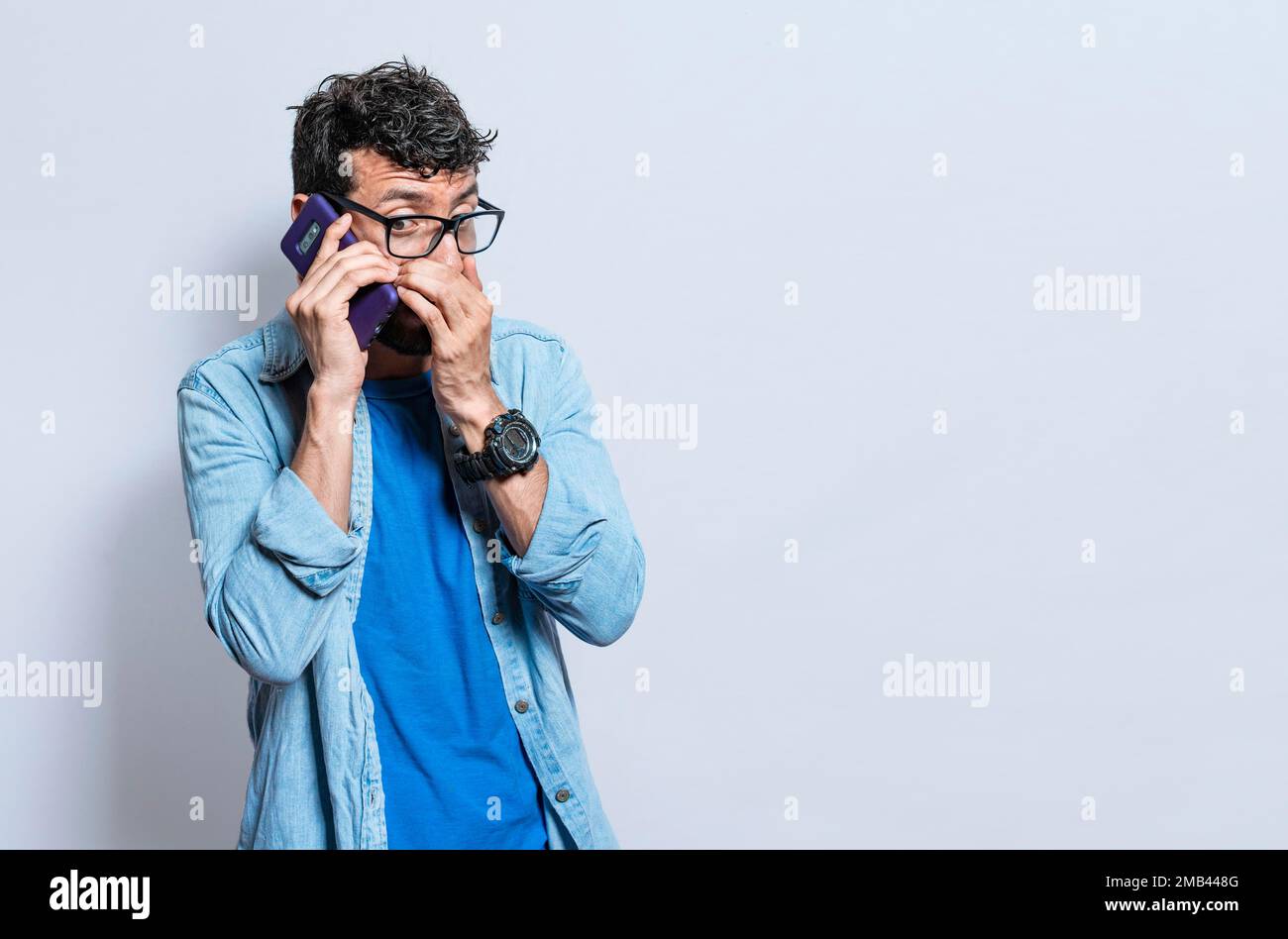 Person secretly talking on the phone. Young man secretly talking on the ...