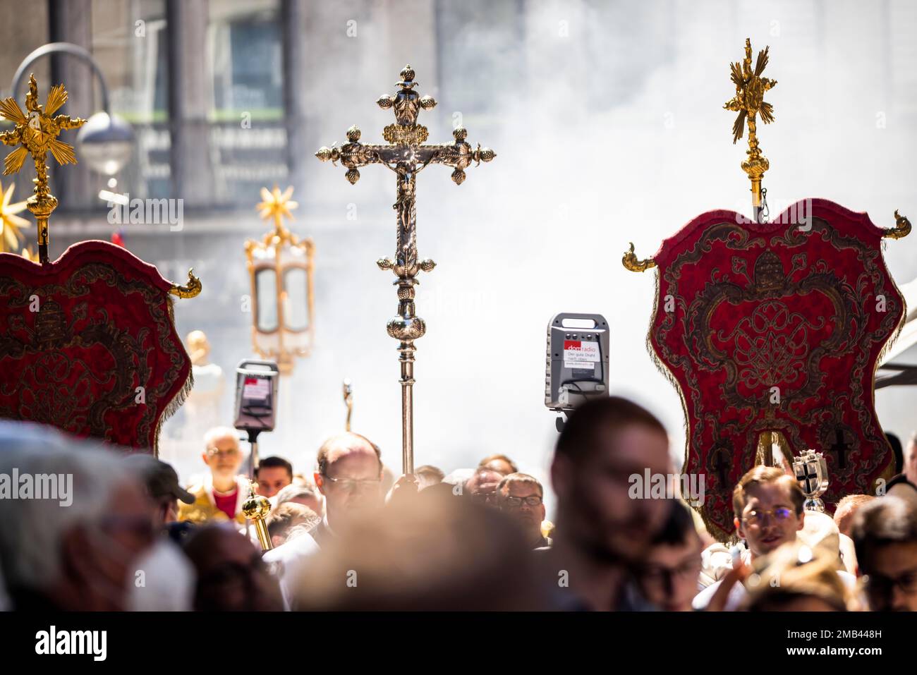 People walk through the streets of the city in incense mist during the ...