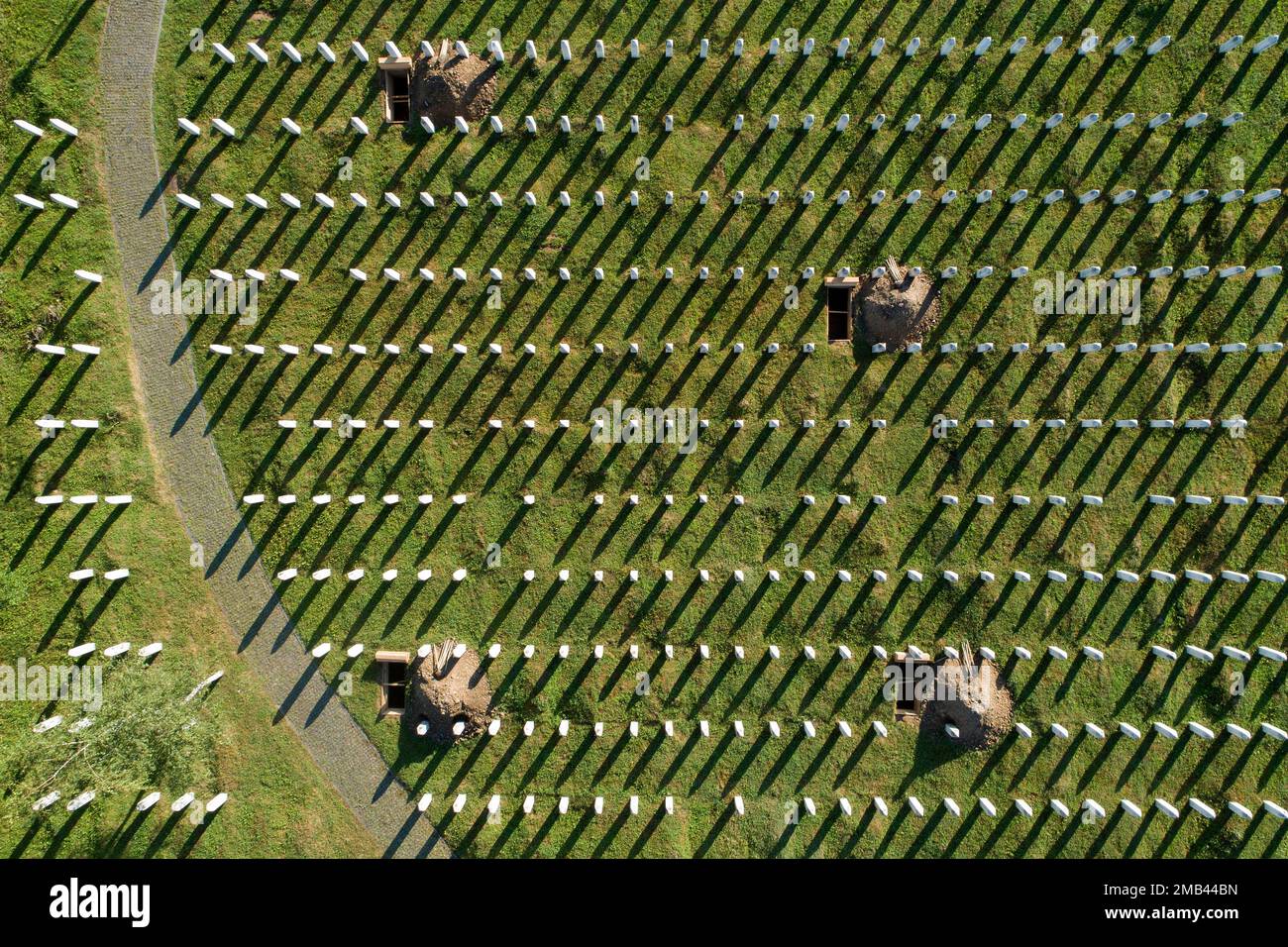 An aerial view of the Srebrenica Genocide Memorial Center and the newly dug graves in Potocari ...