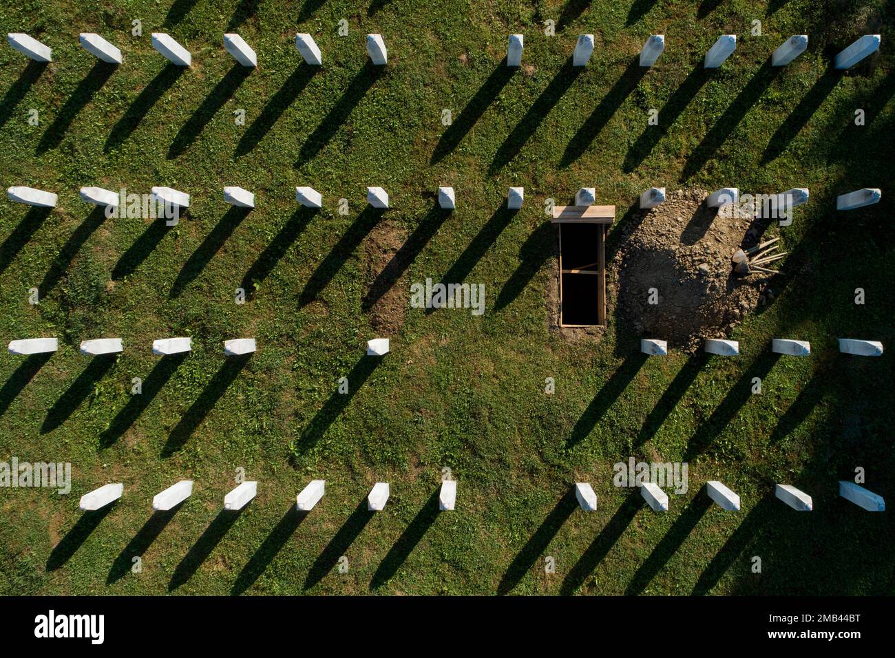 An aerial view of the Srebrenica Genocide Memorial Center and the newly dug graves in Potocari ...