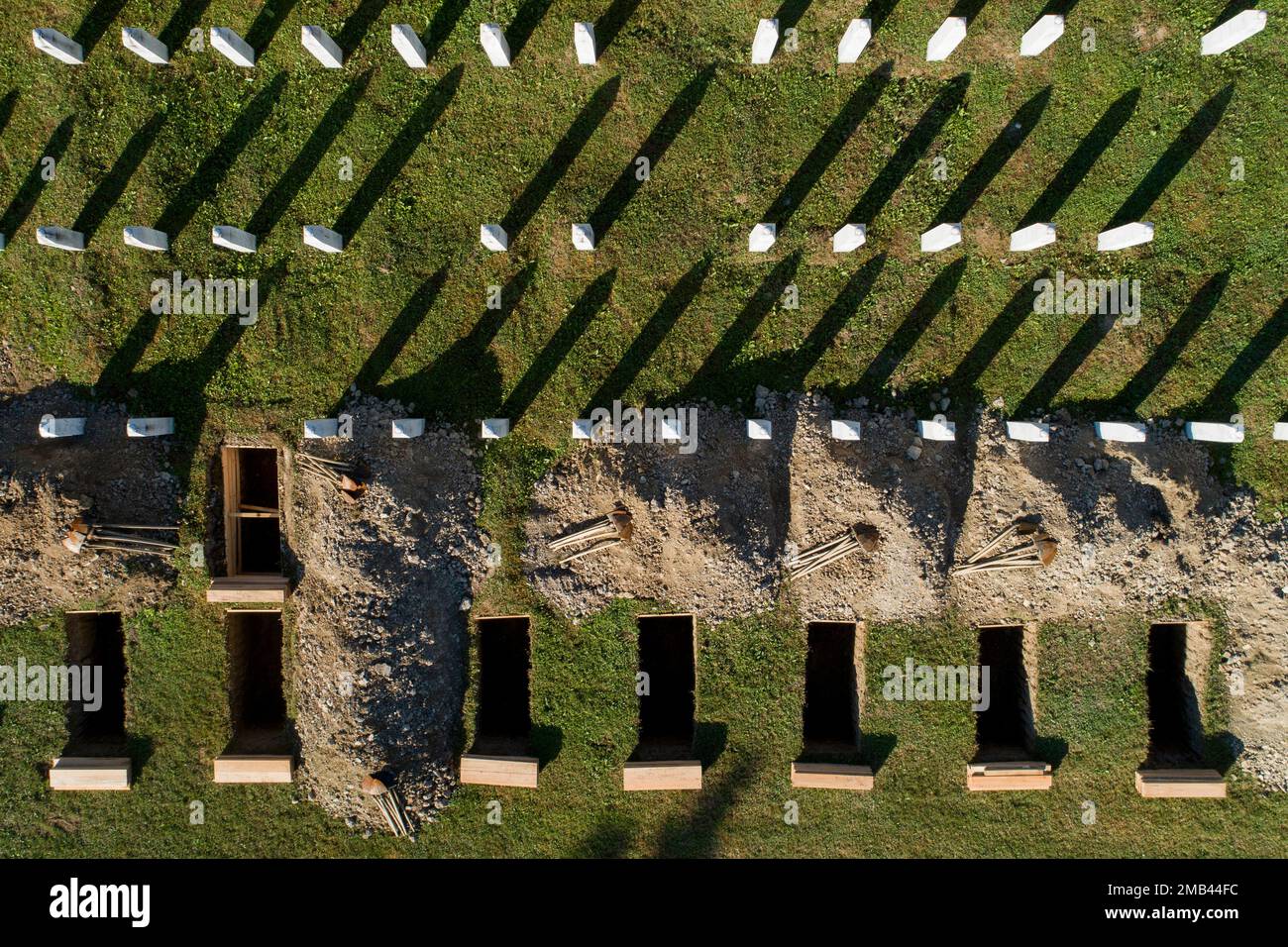 An aerial view of the Srebrenica Genocide Memorial Center and the newly dug graves in Potocari ...