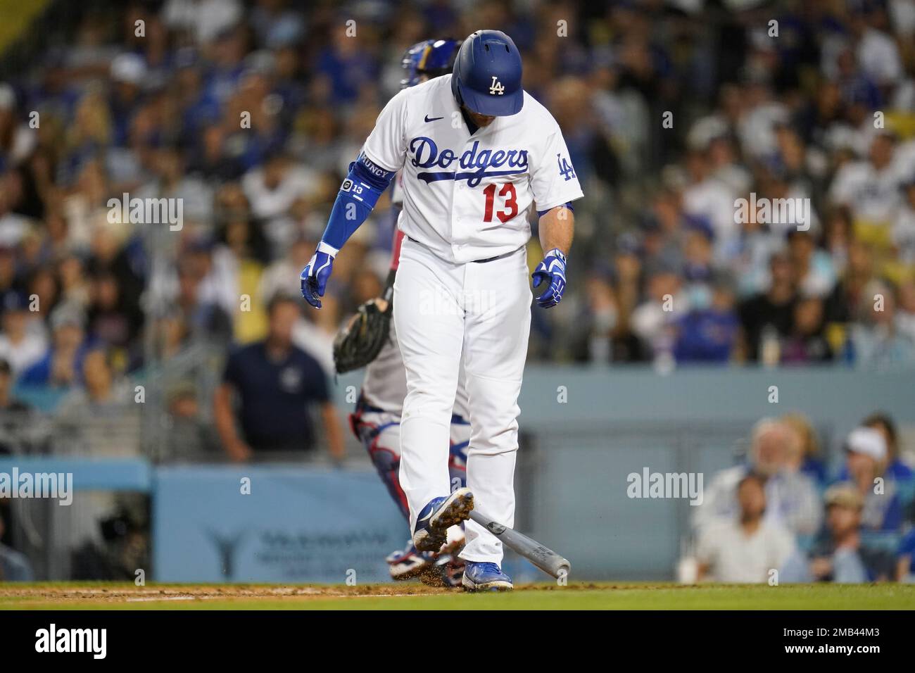 Los Angeles Dodgers' Max Muncy (13) kicks his bat after striking out ...