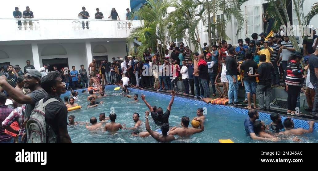 Anti government protesters swim in a swimmingpool of the Sri lankan ...