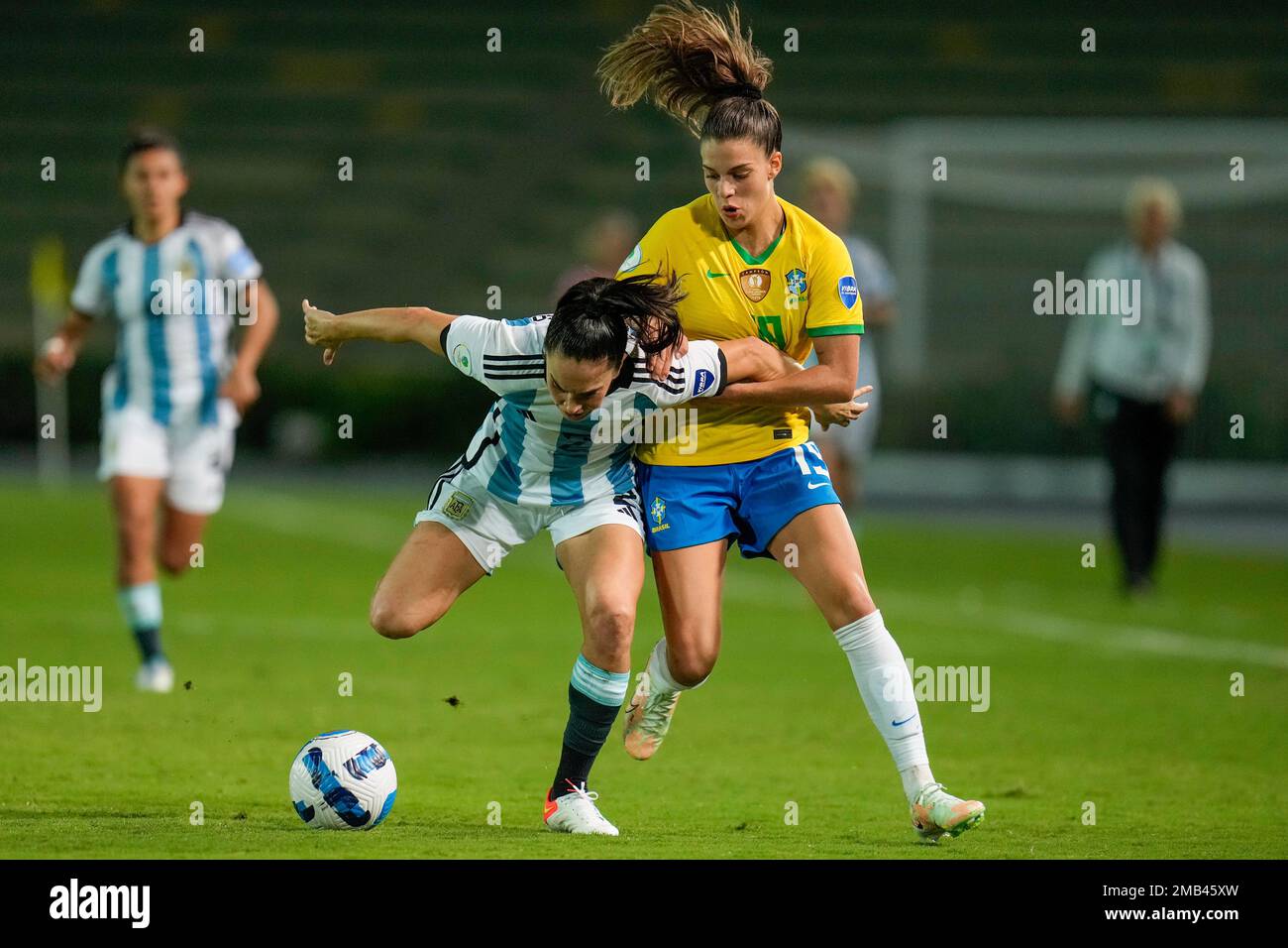 Argentina's Agustina Barroso, left, and Brazil's Gio fight for the ball ...