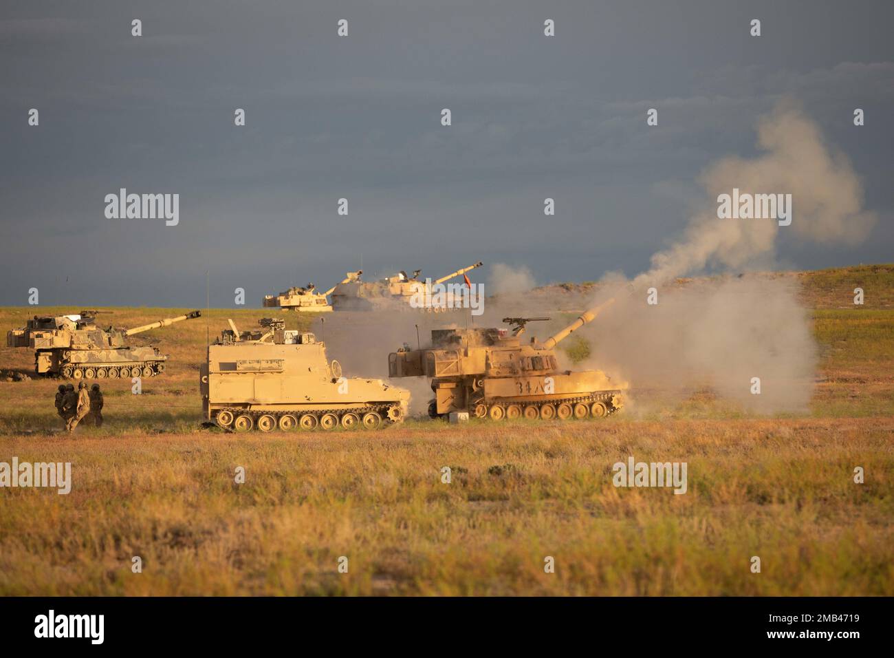 Crew members from Bravo Battery, 1st Battalion, 145th Field Artillery, Utah National Guard, fire ...