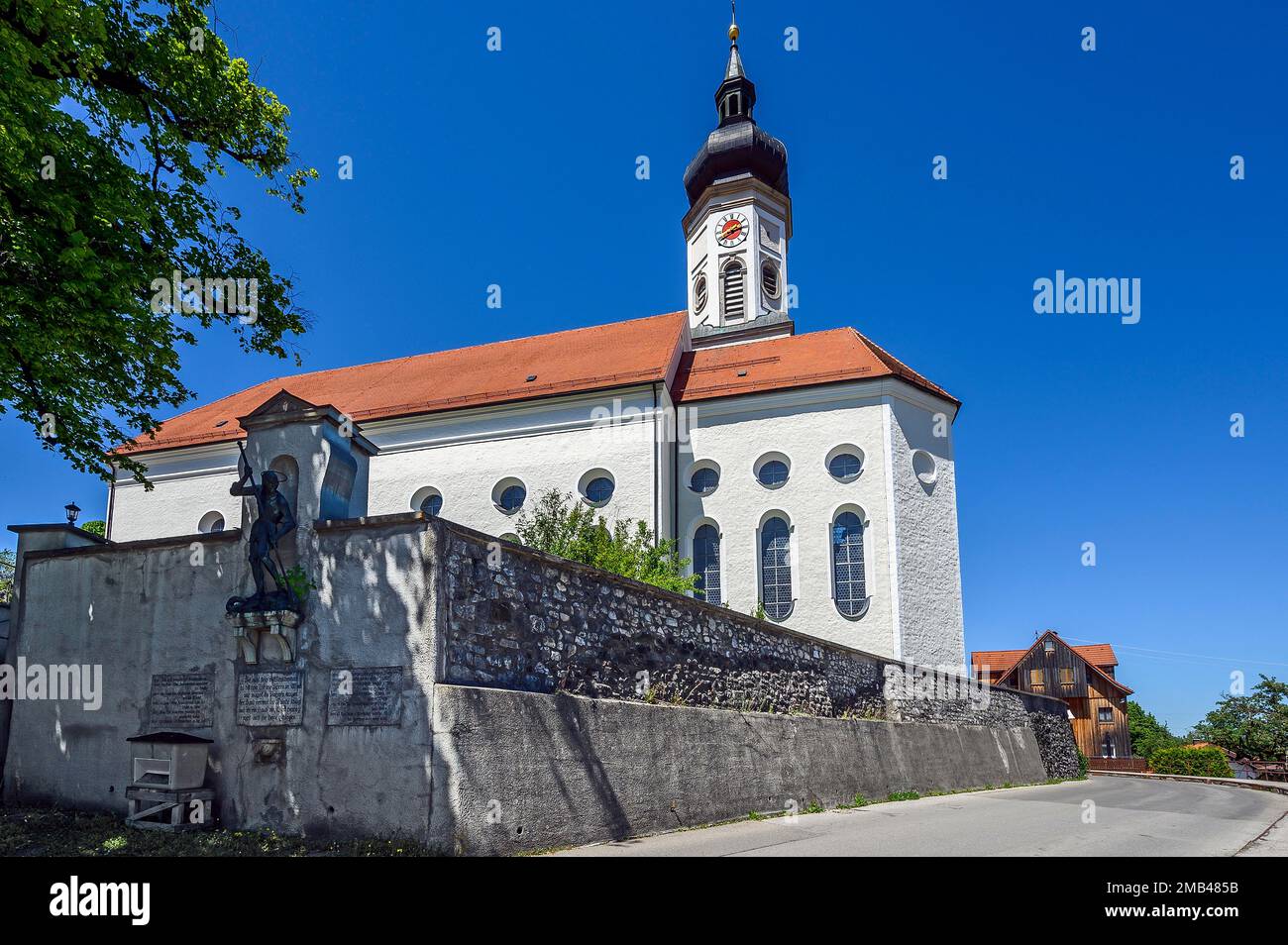 Church of St. Ulrich and cemetery wall with dragon slayer in Wertach ...
